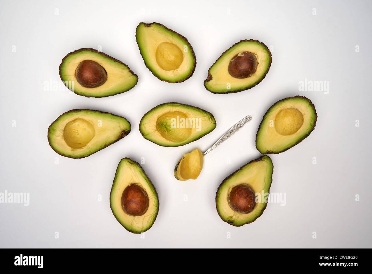 Closeup of fresh avocado sliced isolated on white background Stock ...
