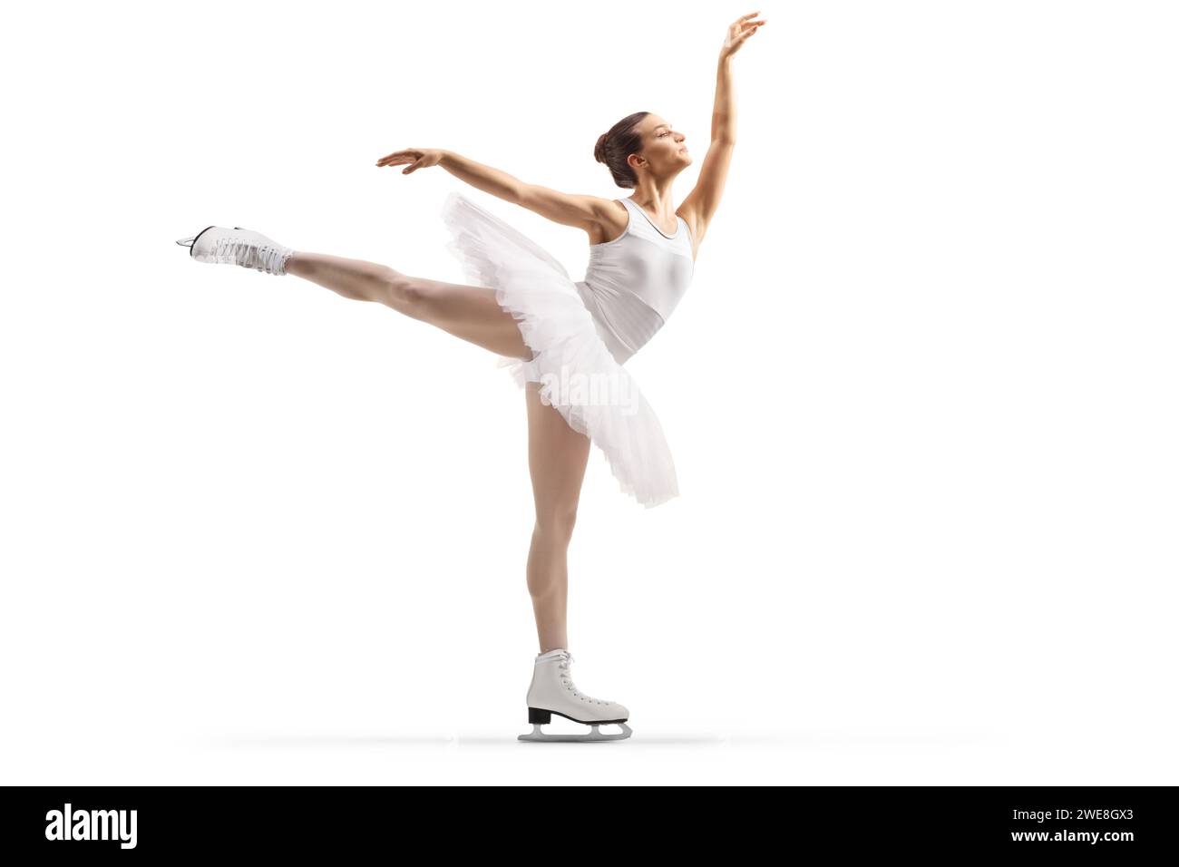 Full length profile shot of a female ice figure skater performing ...