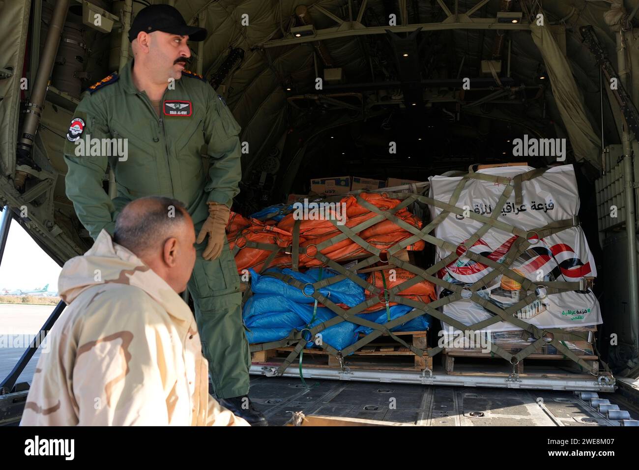 Iraqi security forces prepare for loading humanitarian aid from Red ...