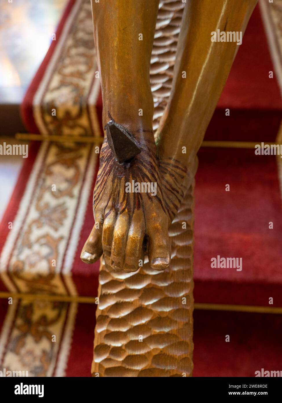 Detail of Christ's feet on the cross. Close-up of feet. Holy Week in ...