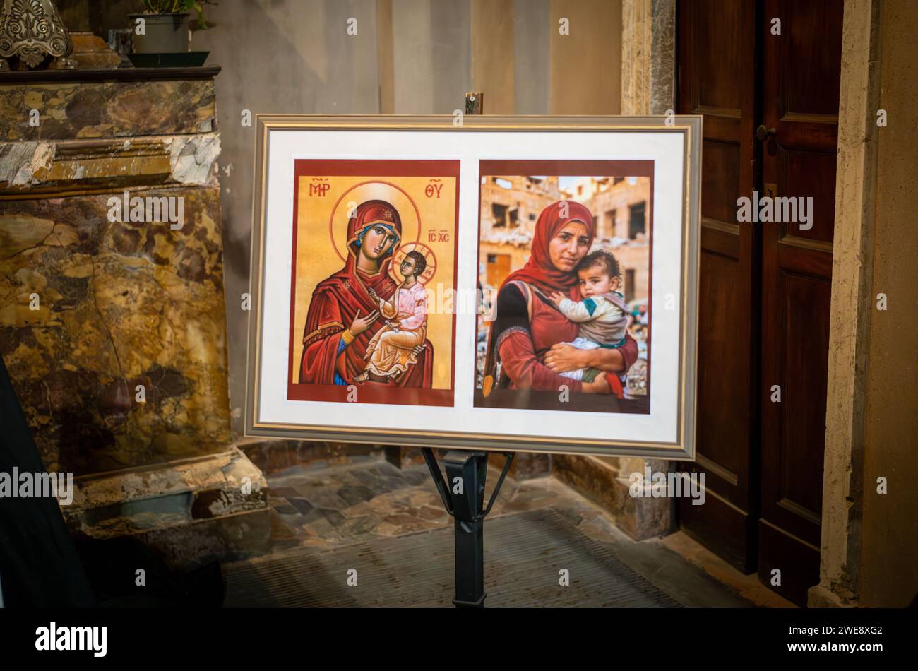 A picture of the Virgin Mary with Jesus next to a similar phoro of a ...