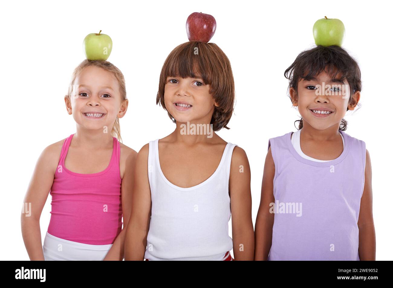 Portrait, apple or happy kids in studio with nutrition, wellness or ...
