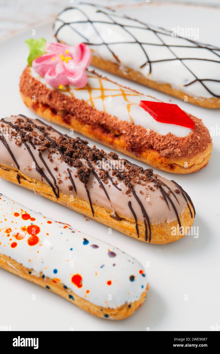 Beautiful delicious french eclairs set with original cream decor on ...