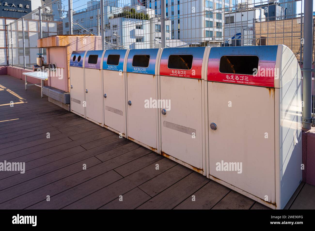 Tokyo, Japan. January 2024. bins for separate waste collection on a street in the city center ...