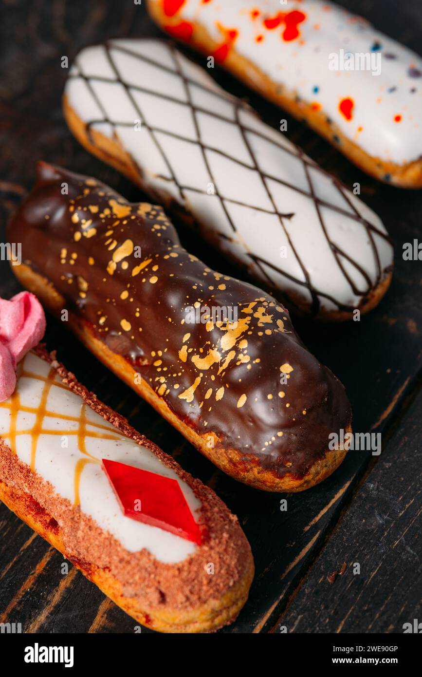 Beautiful delicious french eclairs set with original cream decor on ...