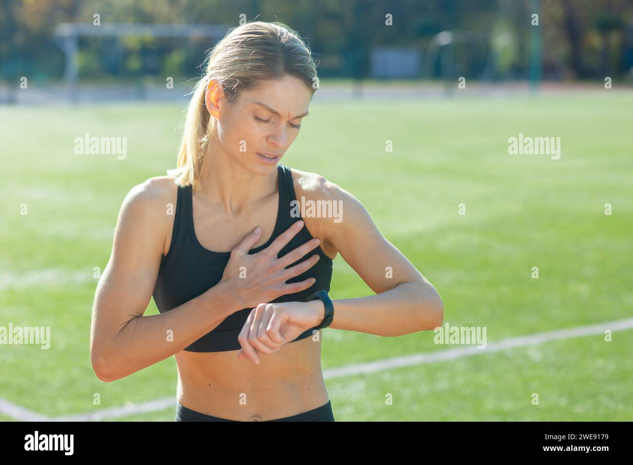 Exhausted woman after jogging catching hi-res stock photography and ...