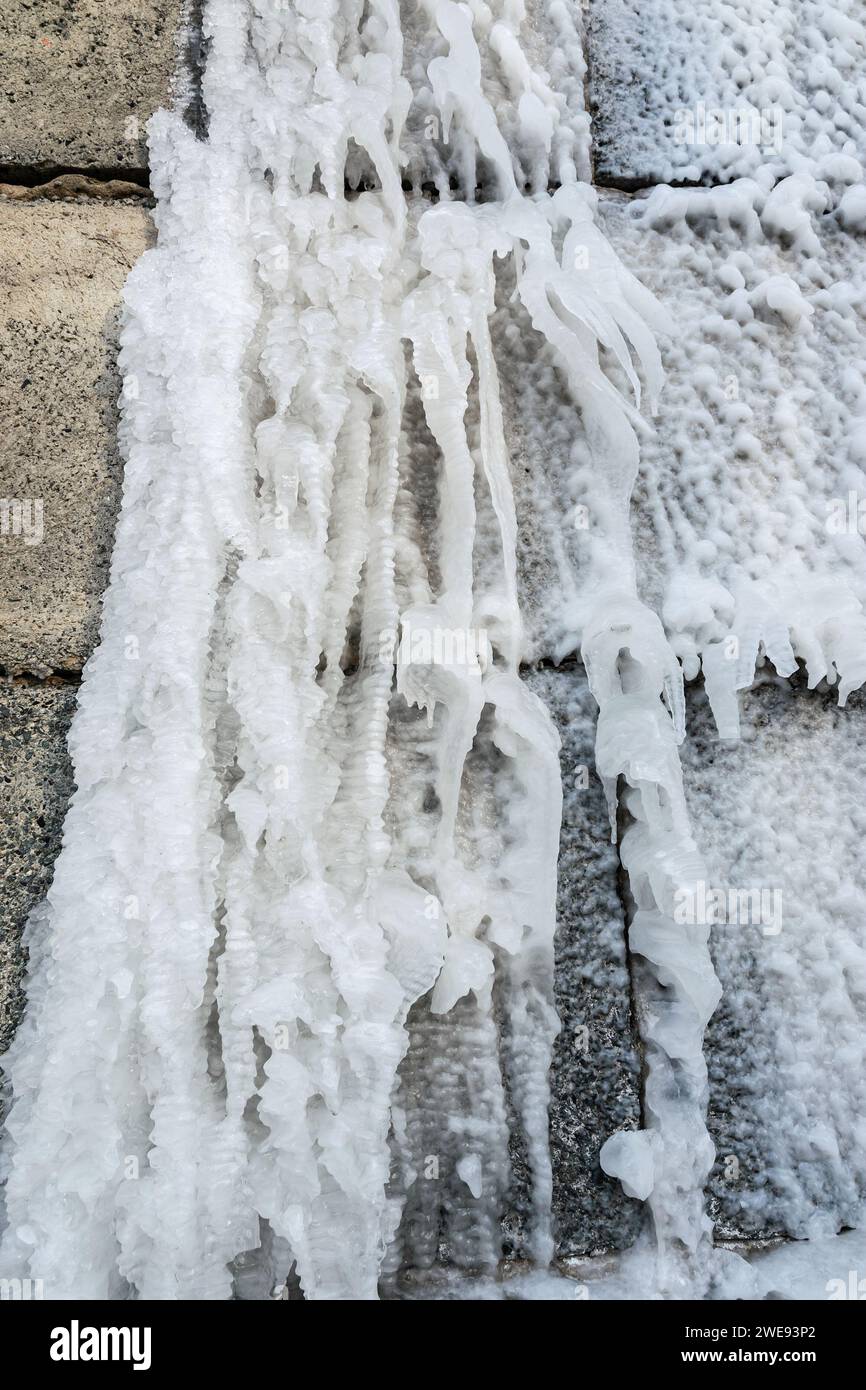 Frozen water after burst from a pipe at the winter Stock Photo - Alamy