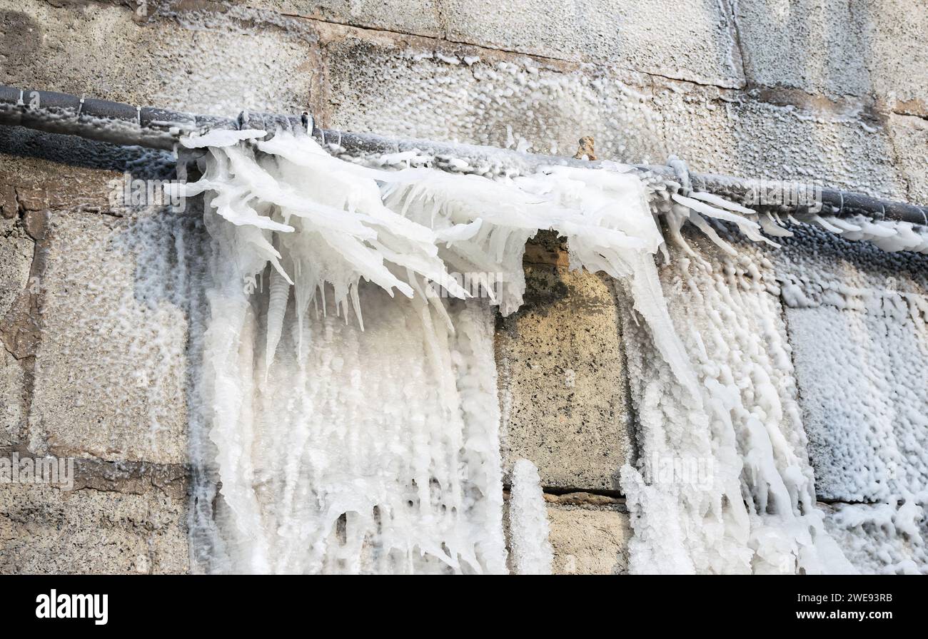 Frozen water after burst from a pipe at the winter Stock Photo - Alamy