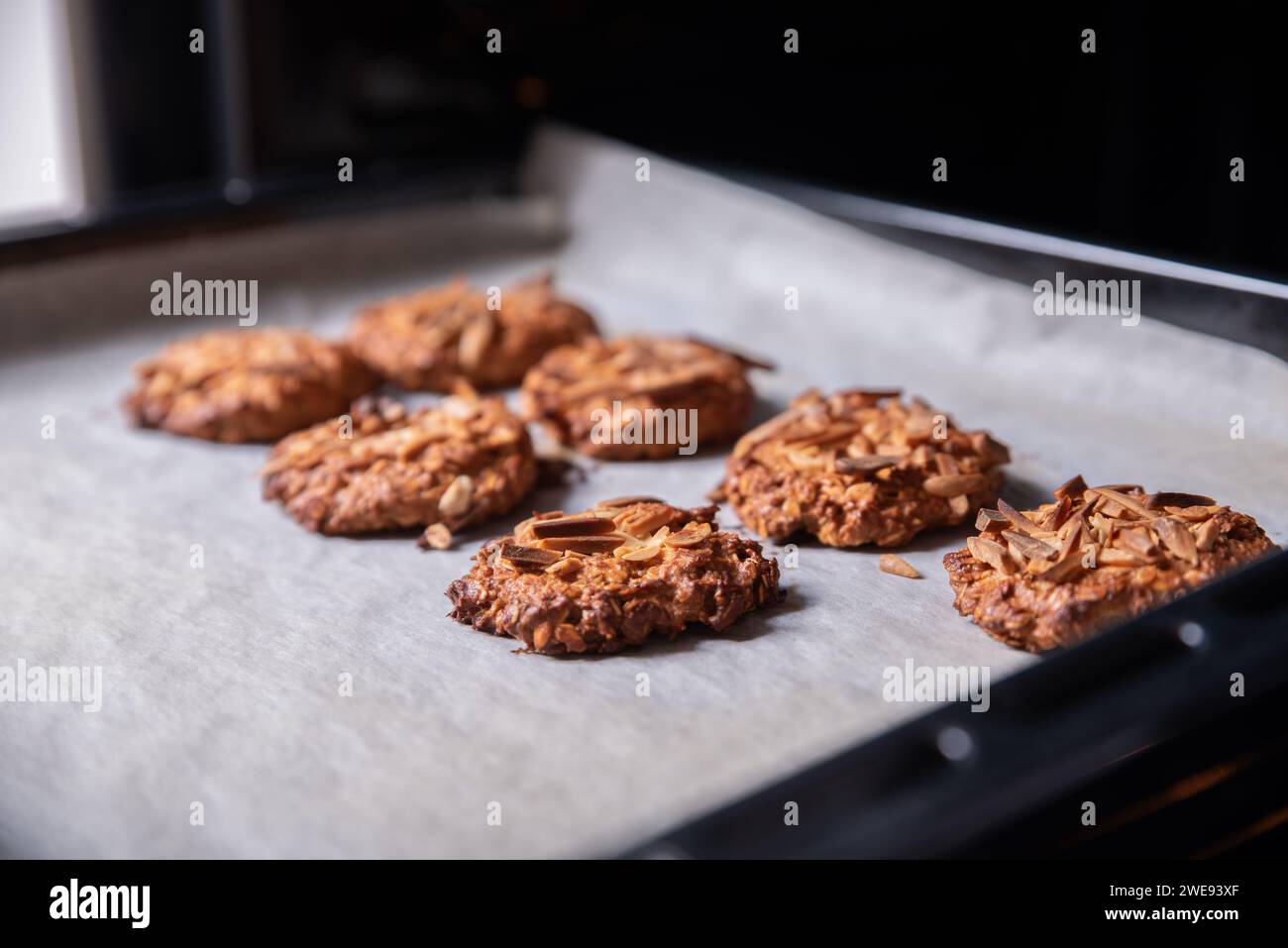 Woman baking cookies in oven hi-res stock photography and images - Alamy