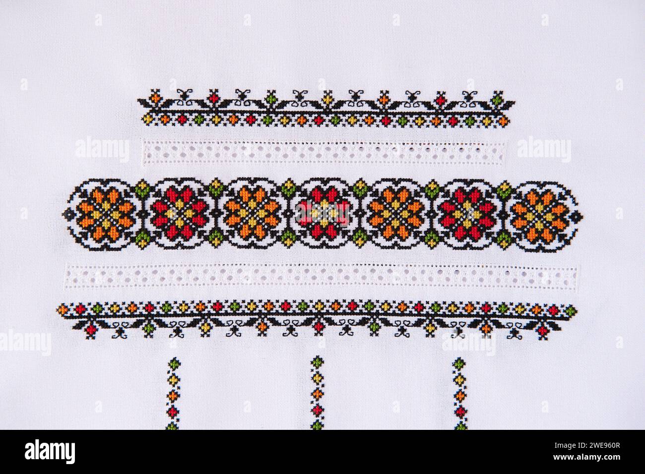 Texture of linen white fabric with embroidered element. Ukrainian ...