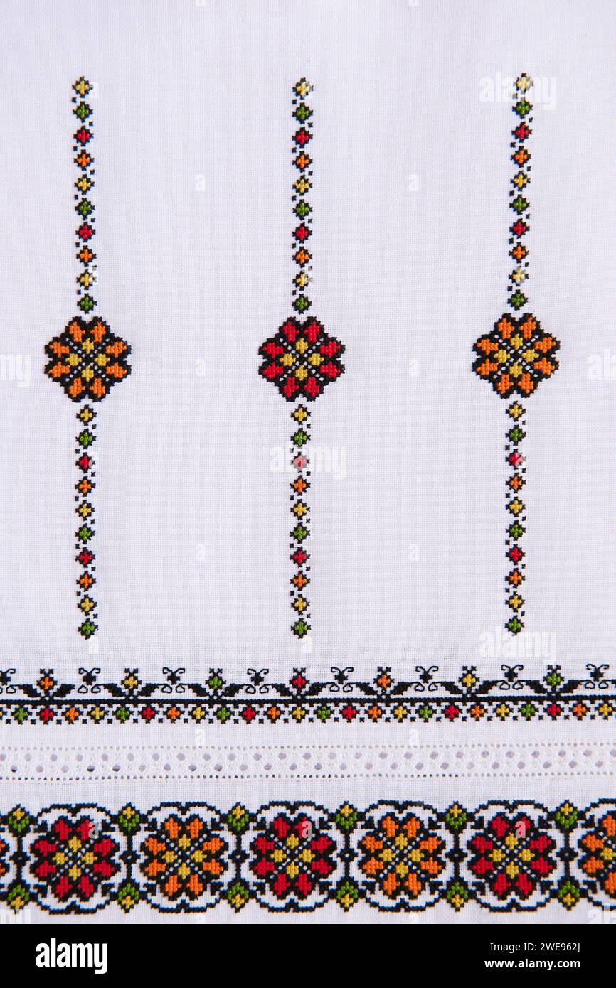 Texture of linen white fabric with embroidered element. Ukrainian ...