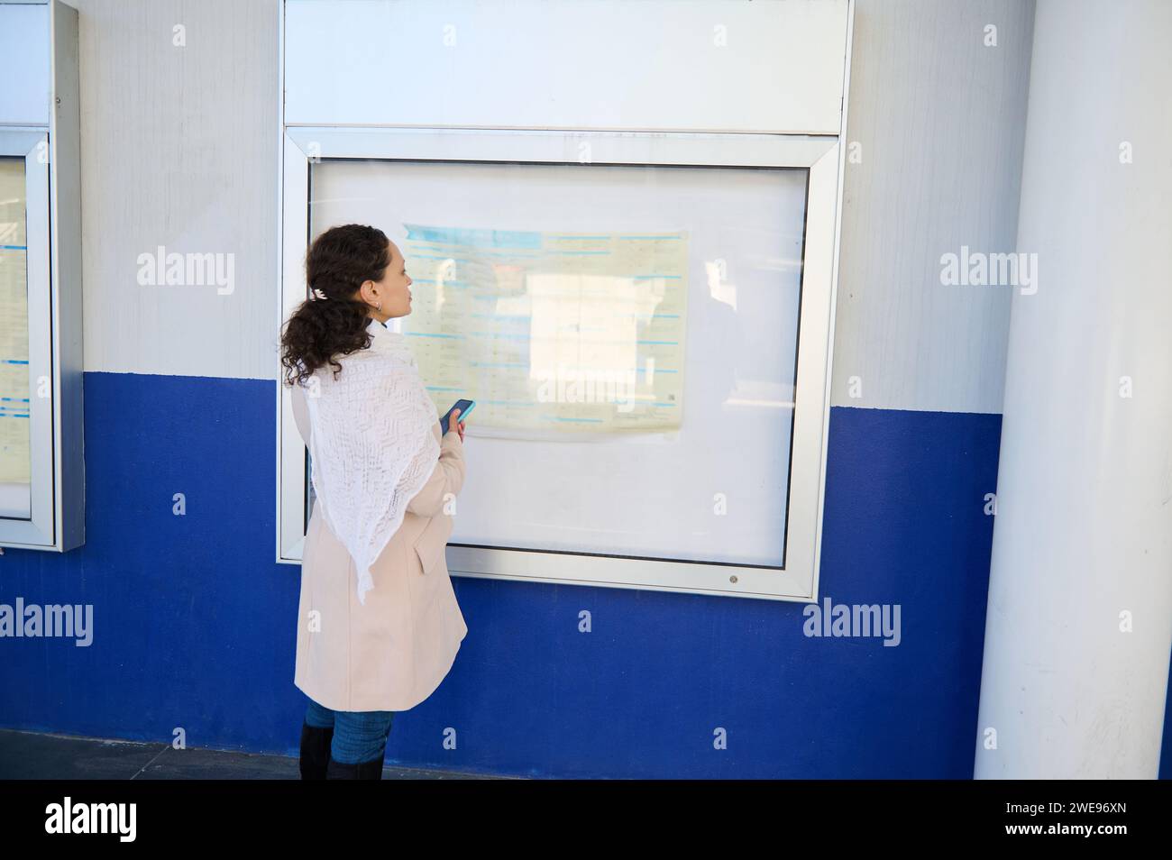 People watching timetable hi-res stock photography and images - Alamy