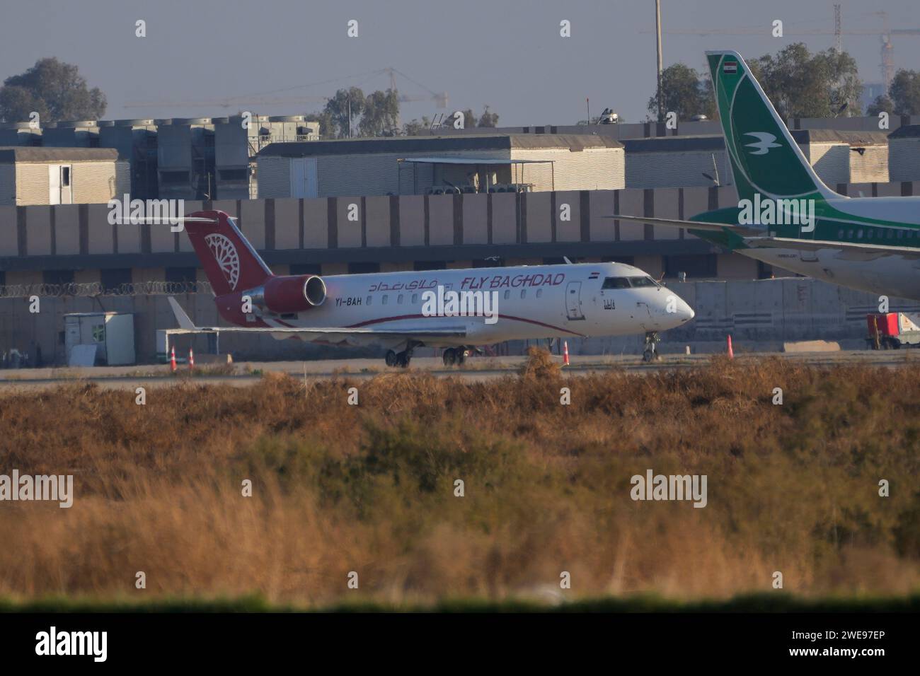 Planes belonging to the Iraqi airline Fly Baghdad are parked at Baghdad ...