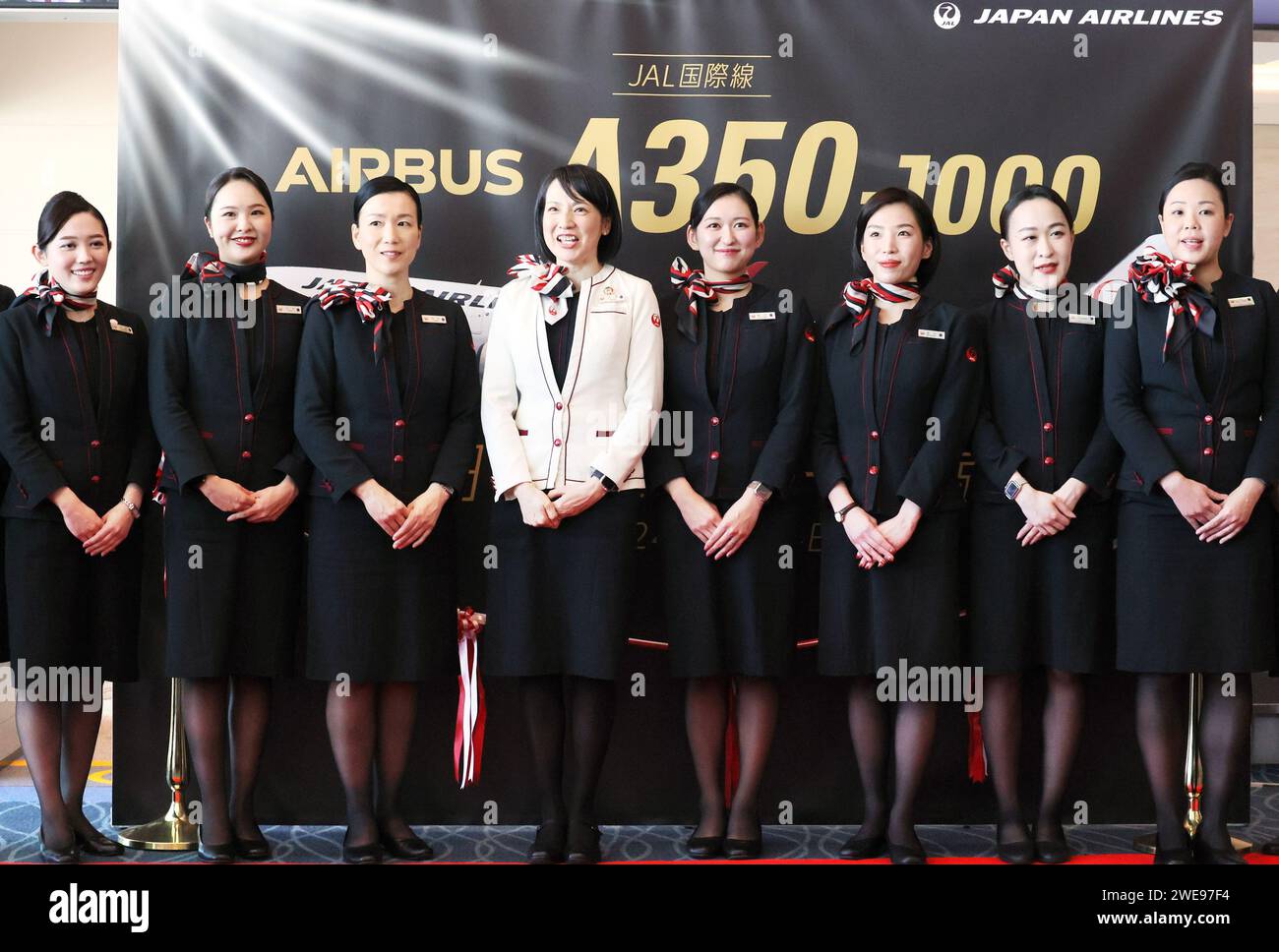 Tokyo, Japan. 24th Jan, 2024. Japan Airlines (JAL) cabin attendants smile as they will provide ...