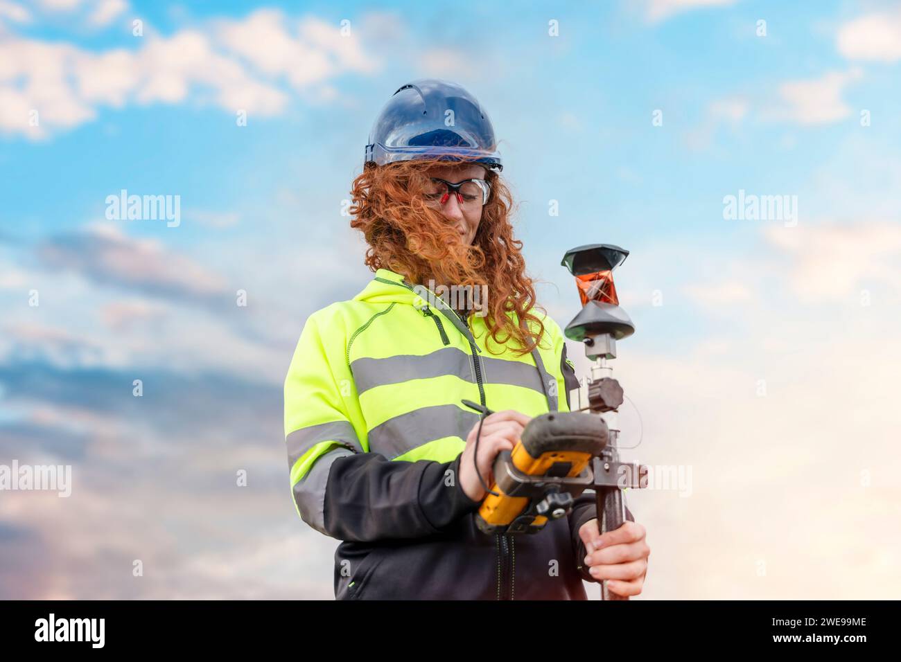 Female Woman land surveyor working with moder surveying geodesic ...