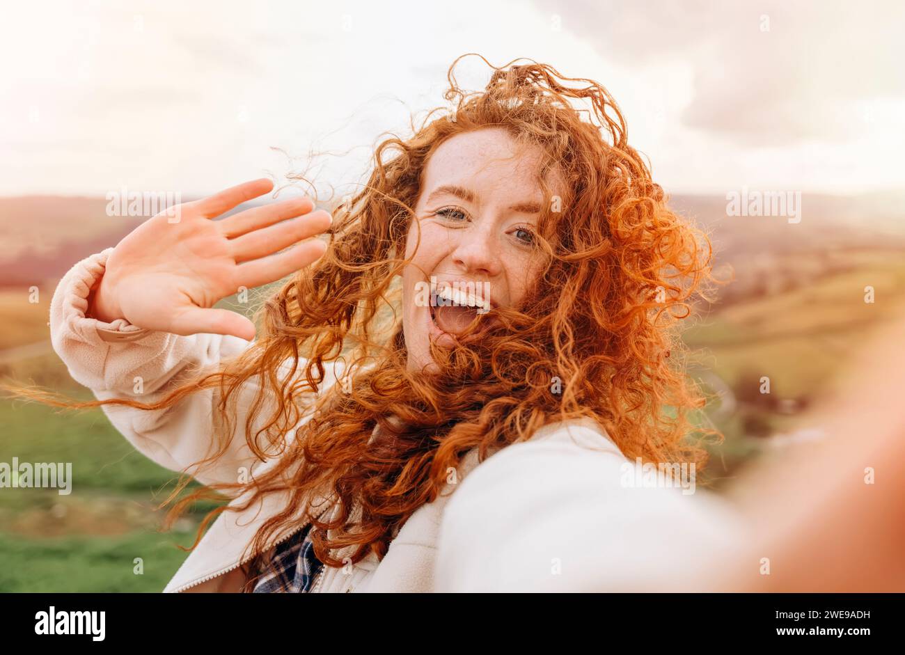 Excited woman in jacket reaching hi-res stock photography and images ...