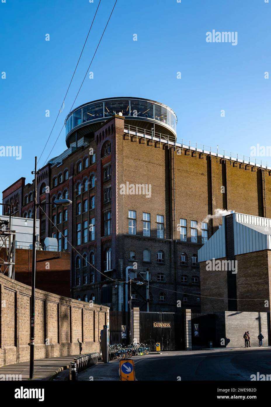 Urban architecture with a modern cylindrical structure atop a ...