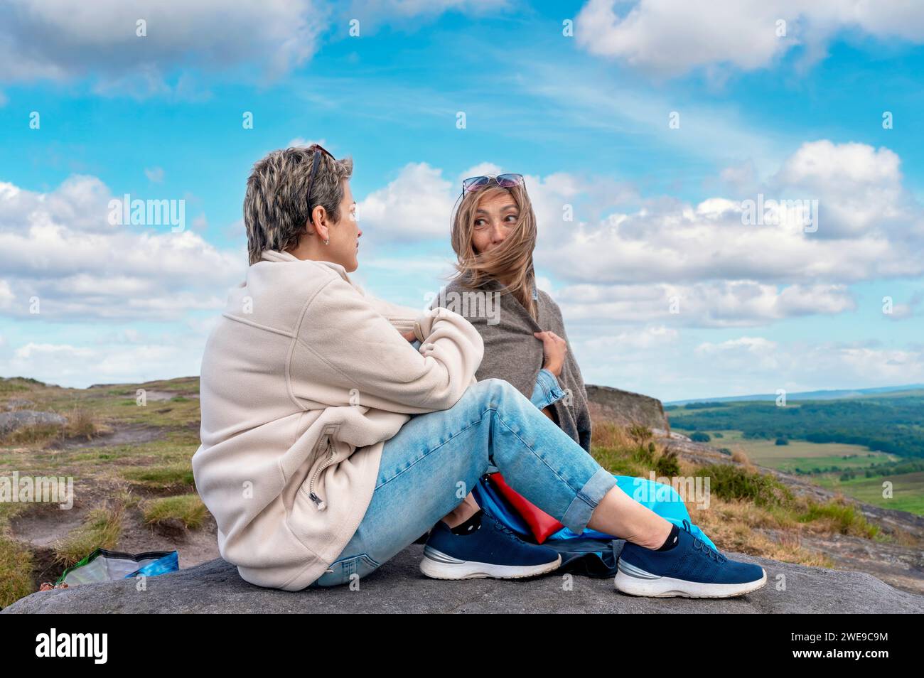 two women travellers in a white jacket traveling reaching destination ...