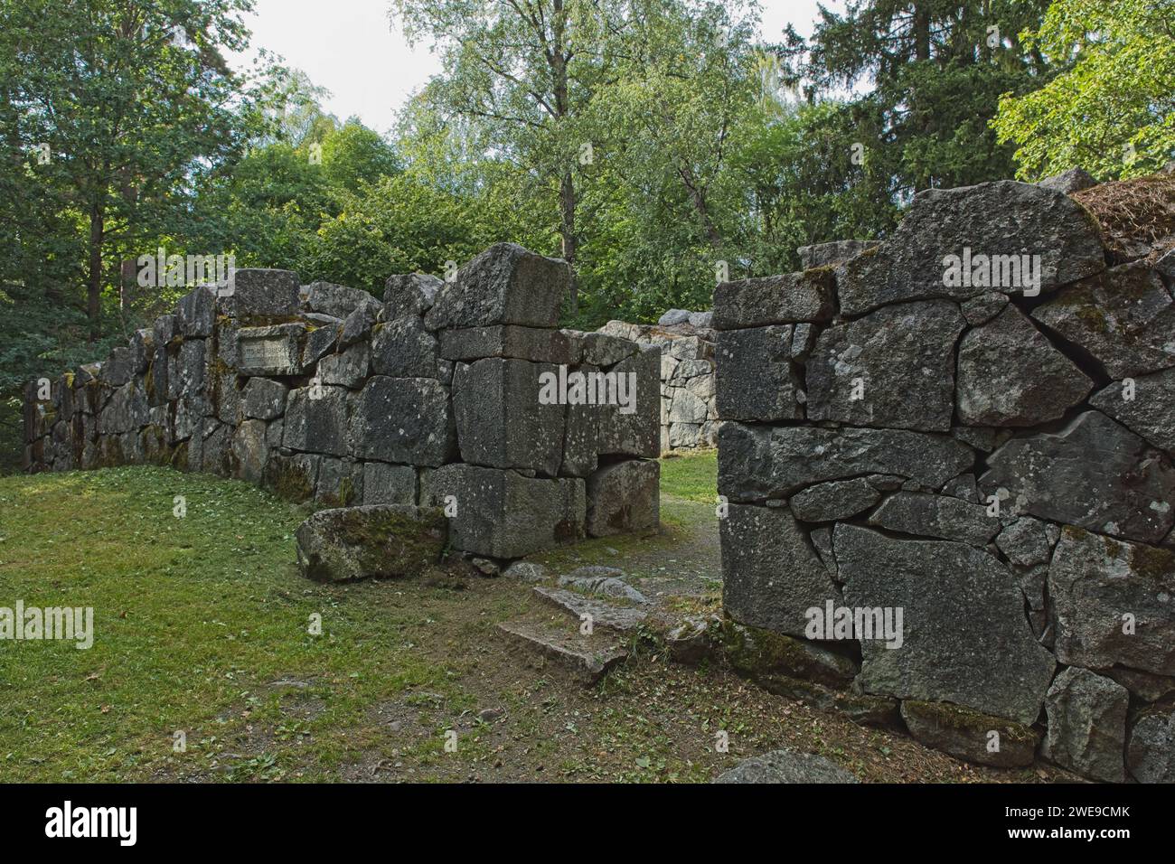 Old stone ruins at Kaupunginpuisto park in forest in summer ...