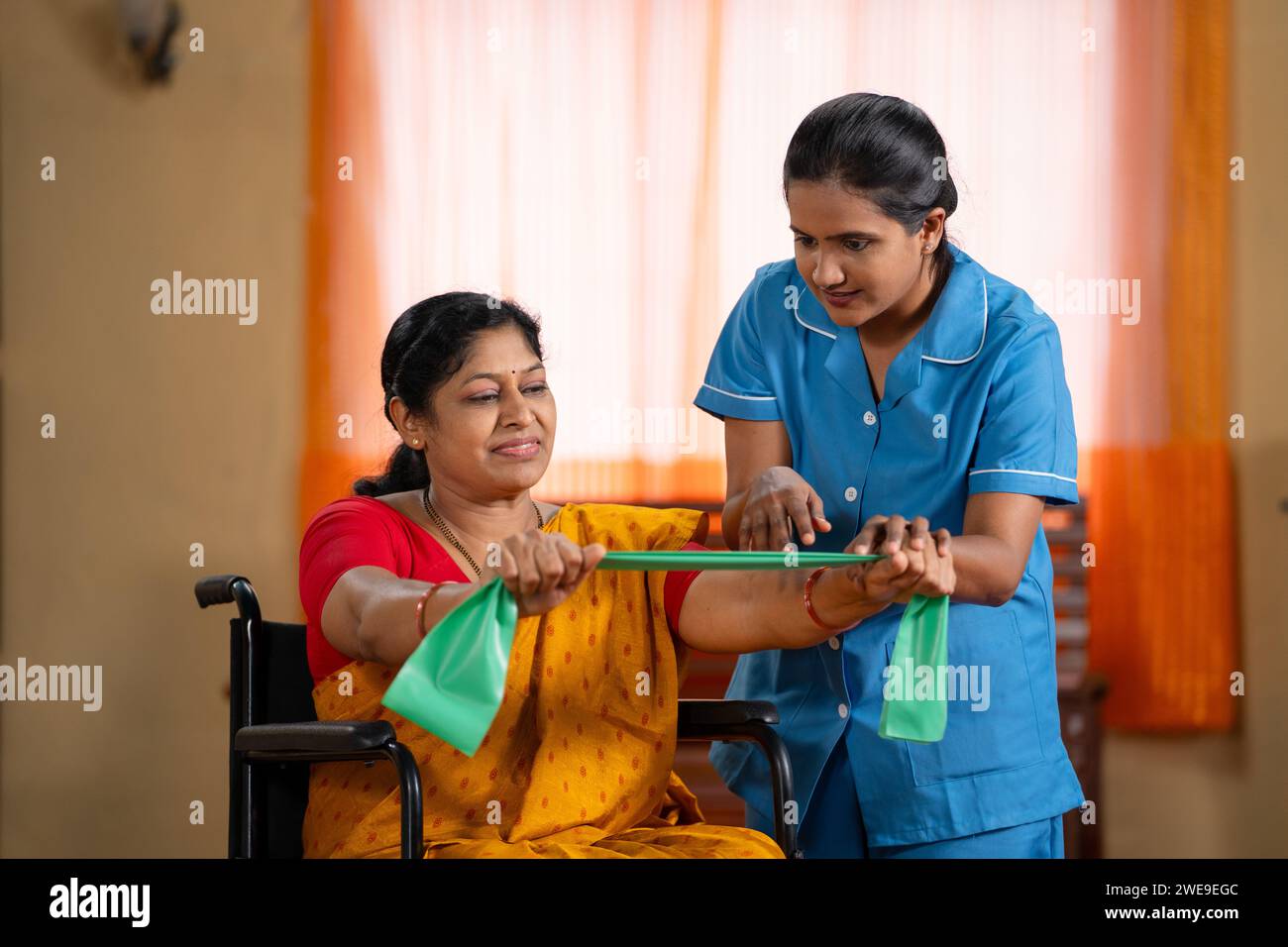 Indian nurse therapist guiding assisting hi-res stock photography and ...