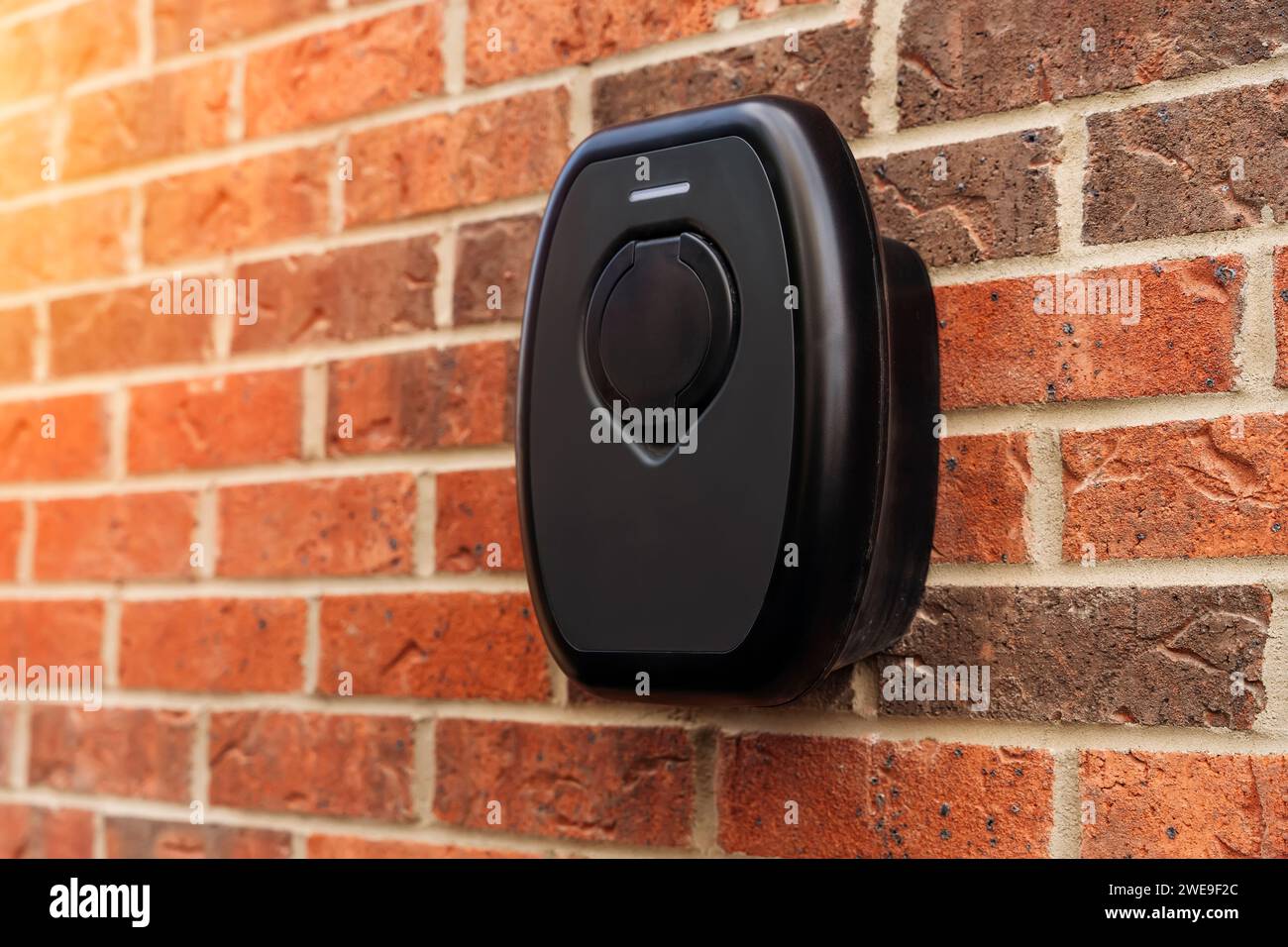 Electric vehicle domestic charging point installed outside of the house ...