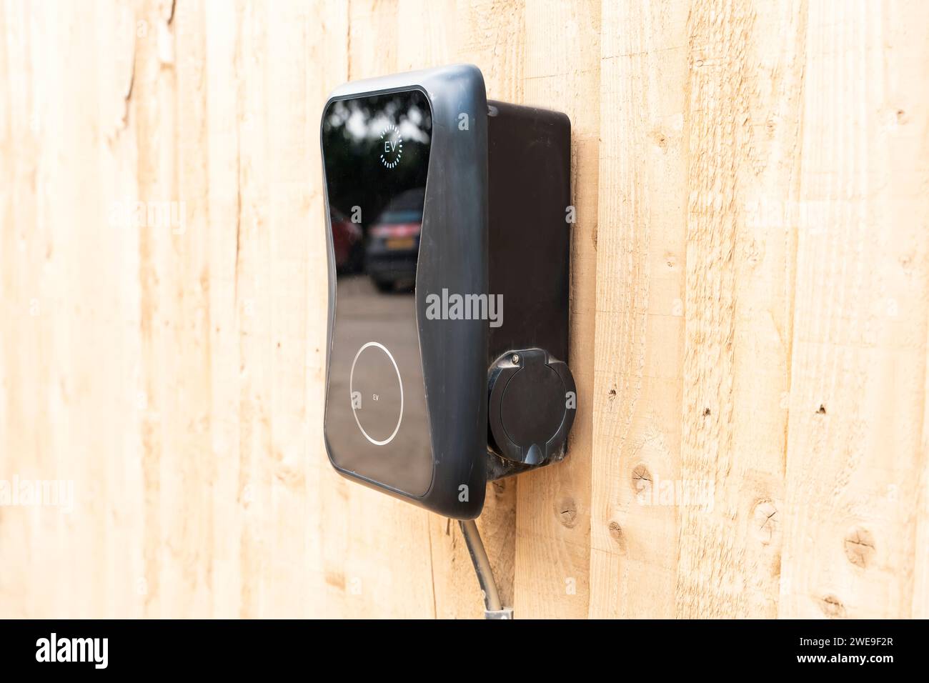 Electric vehicle domestic charging point installed outside of the house ...