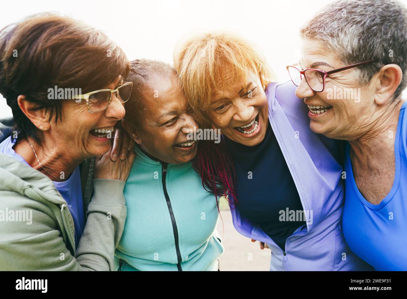 Multiracial senior women having fun together after sport workout ...