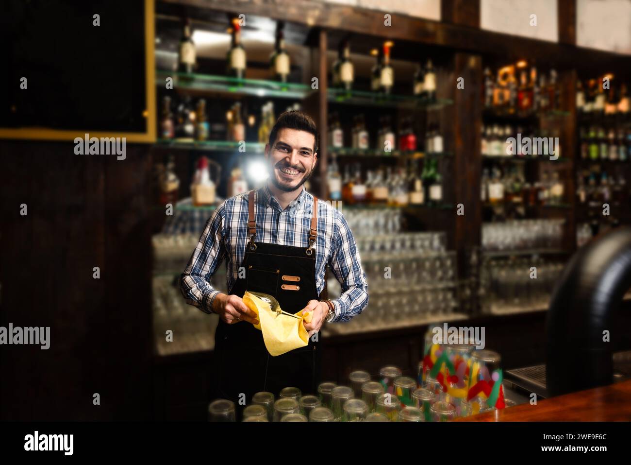 Confident male bartender cleaning bar hi-res stock photography and ...
