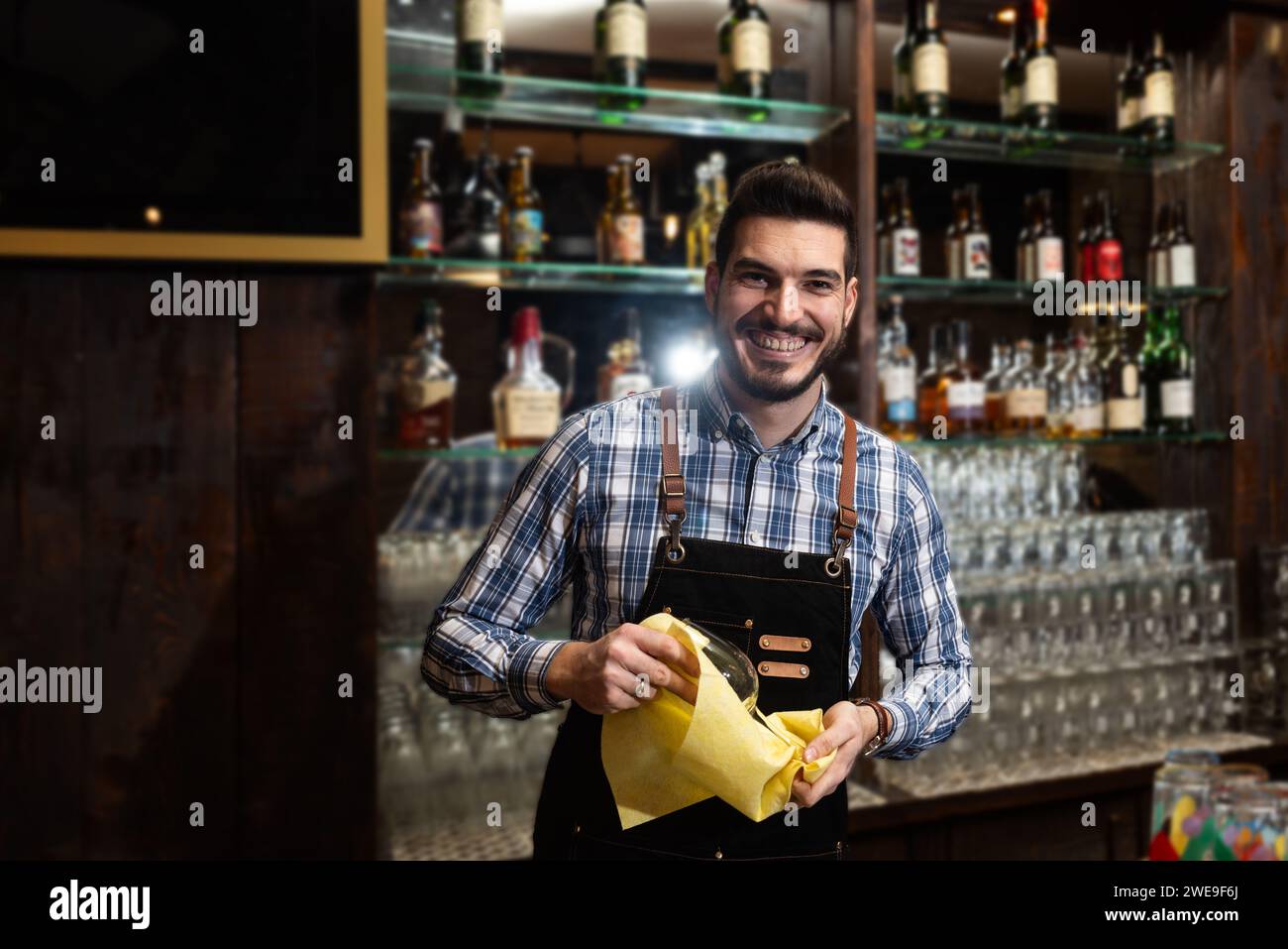 Confident male bartender cleaning bar hi-res stock photography and ...