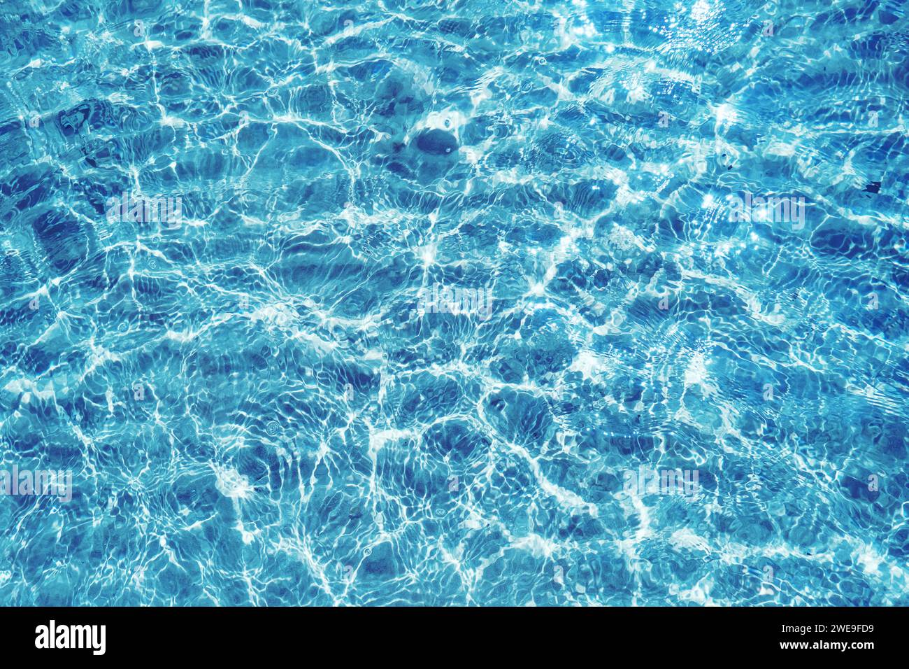 Water ripple over sandy beach. Transparent blue colored clear water ...