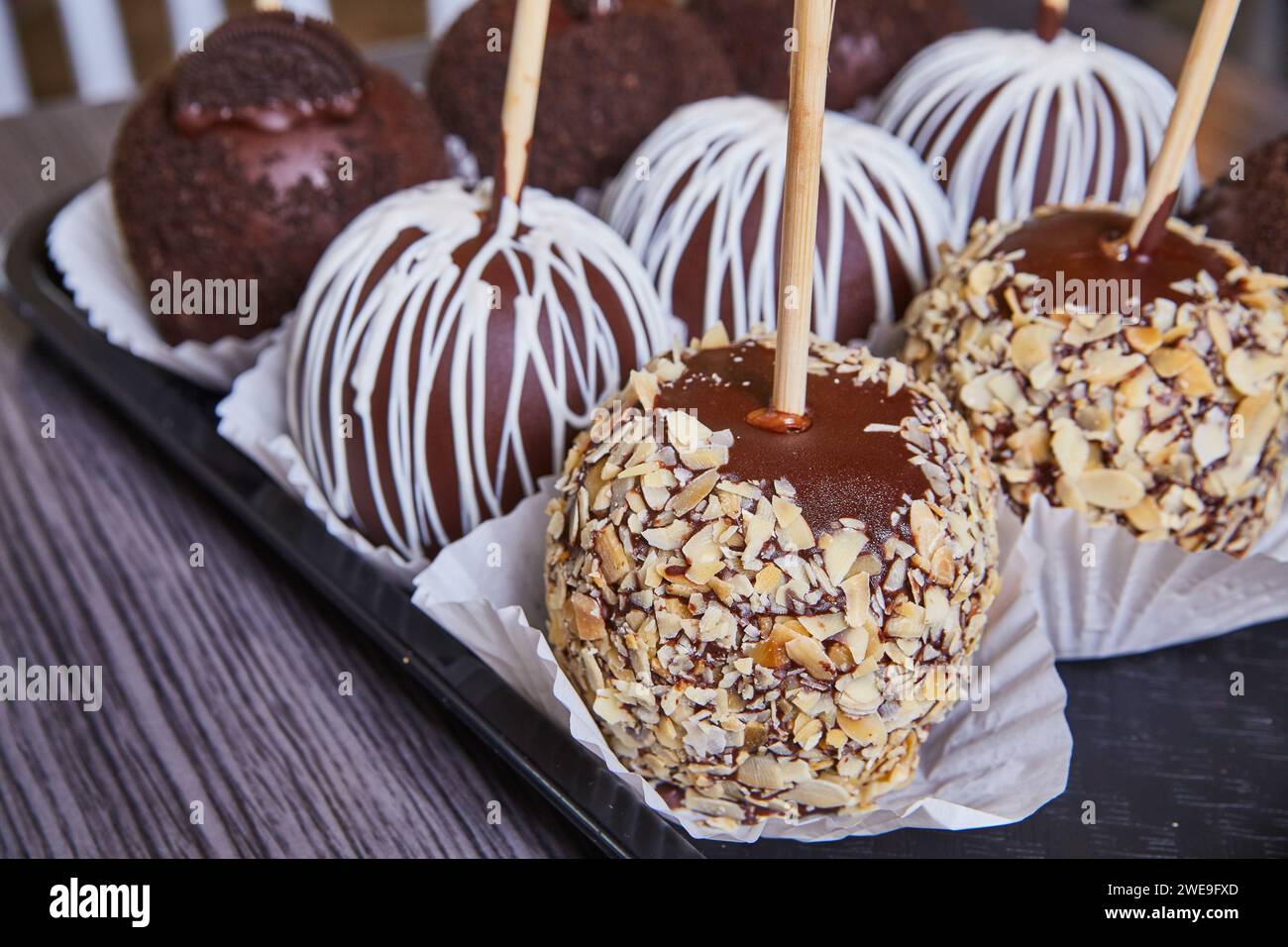 Gourmet Chocolate Dipped Apples with Nuts and Drizzle on Tray Stock ...