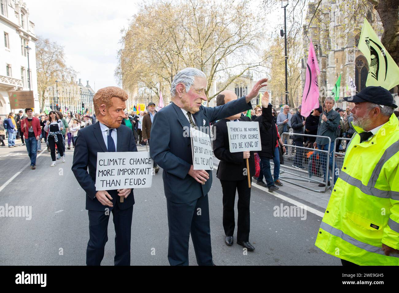 Participants wearing masks of members of Britain’s royal family join ...
