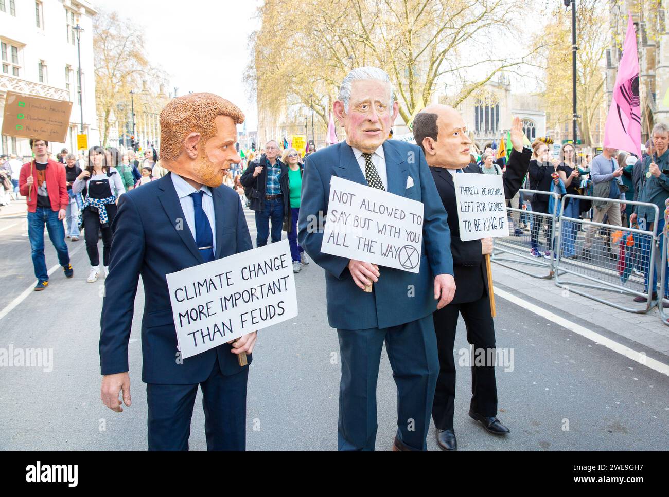 Participants wearing masks of members of Britain’s royal family join ...