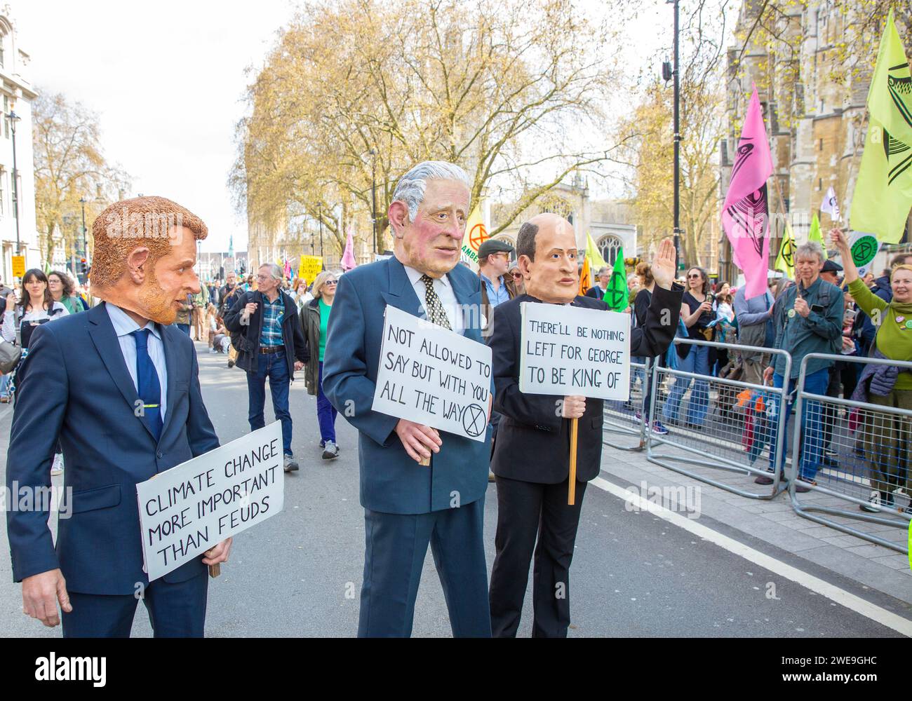 Participants wearing masks of members of Britain’s royal family join ...
