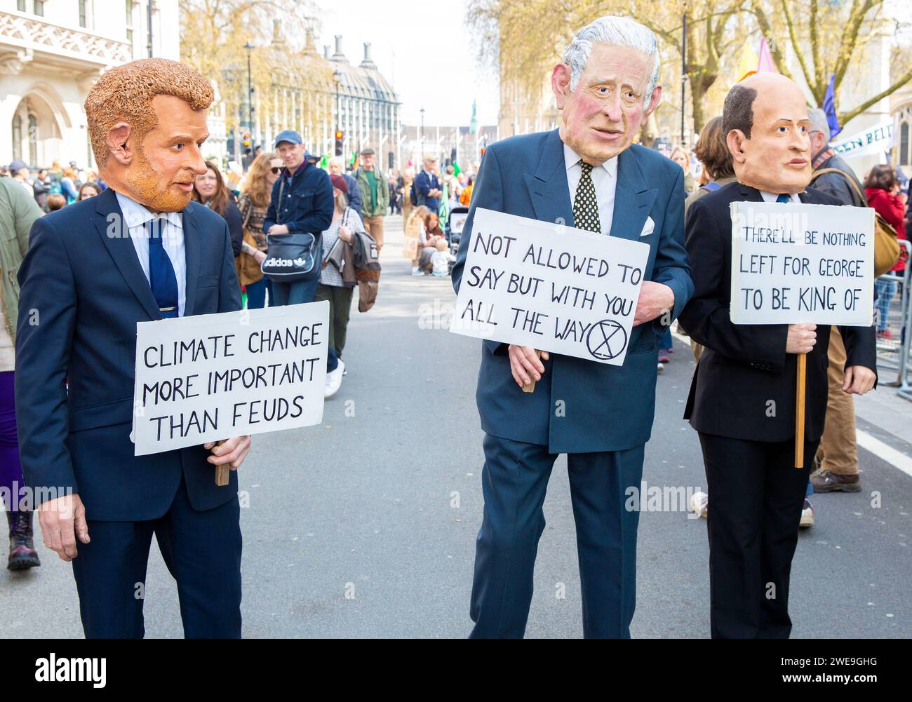 Participants wearing masks of members of Britain’s royal family join ...