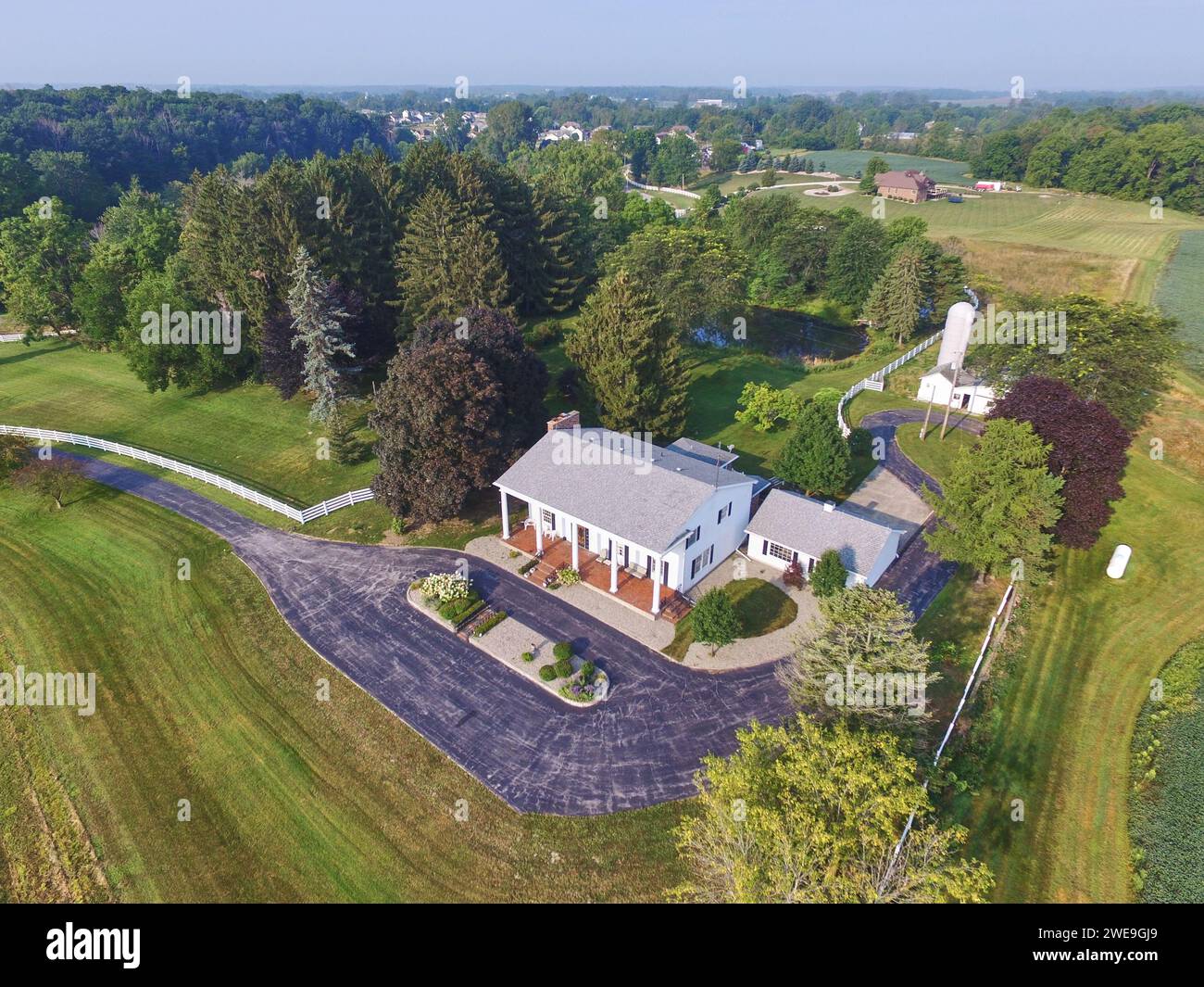 Aerial View of Countryside Estate with White Barn and Pond in Indiana ...