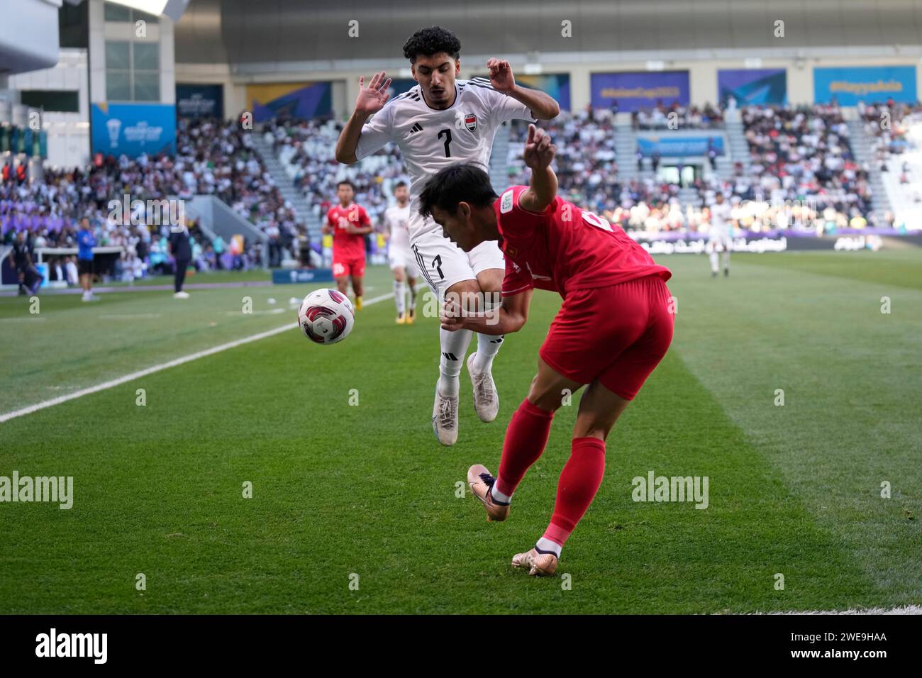 Vietnam's Vo Minh Trong kicks the ball as Iraq's Youssef Wali Amyn ...