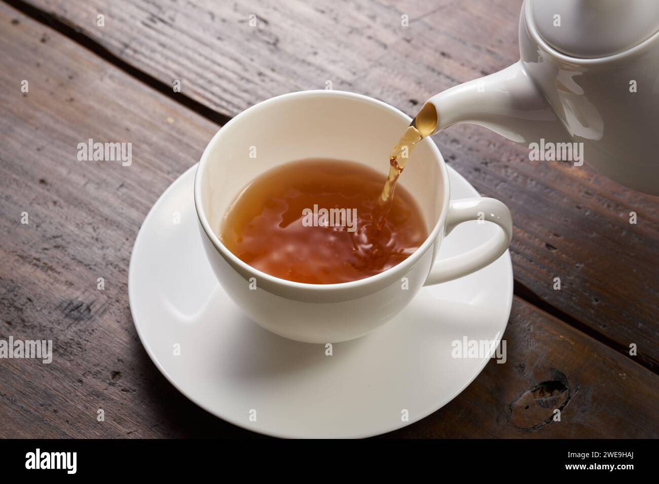 Image of drinking hot tea at tea time Stock Photo - Alamy