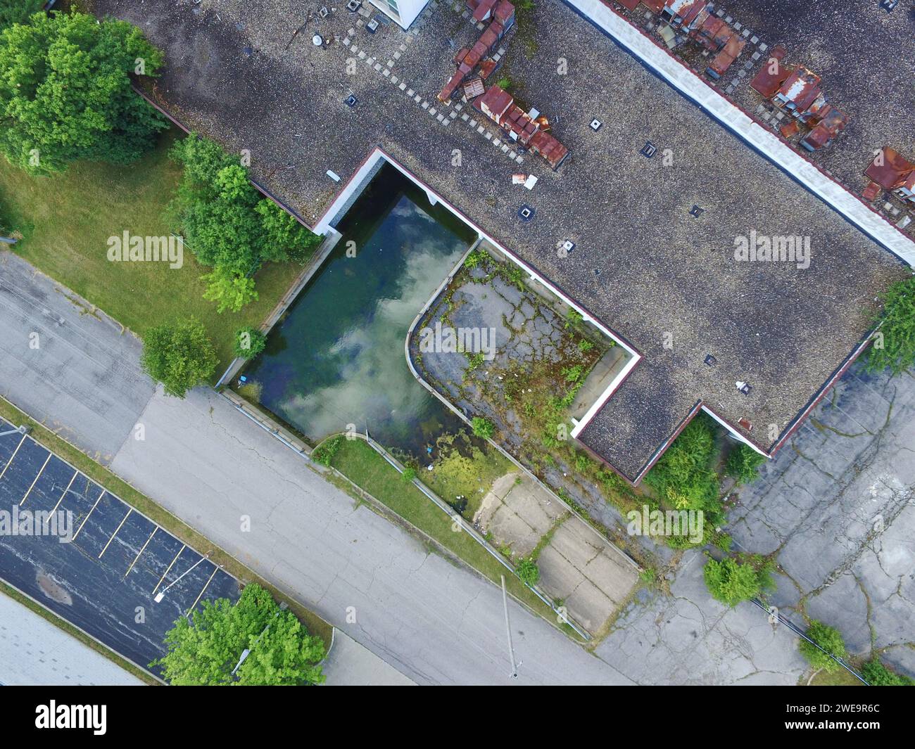Aerial Top Down View of Neglected Urban Building and Overgrown Lot ...