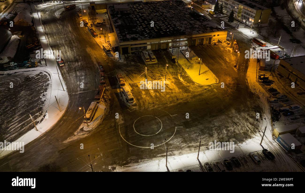 Drone photography of a bus terminal in a city during winter cloudy ...