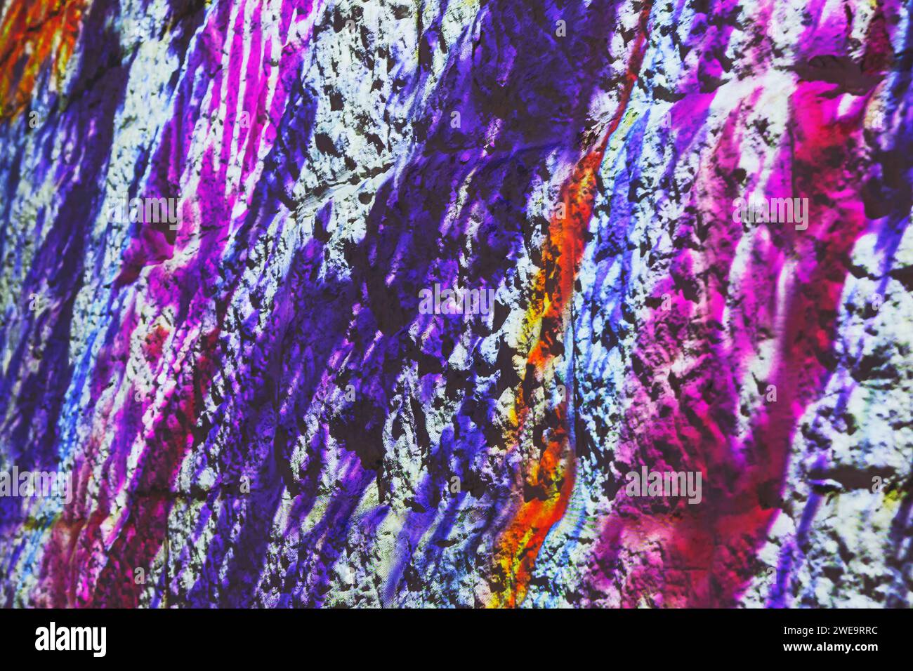 Abstract background with multicolored spots of paint on the wall Stock ...