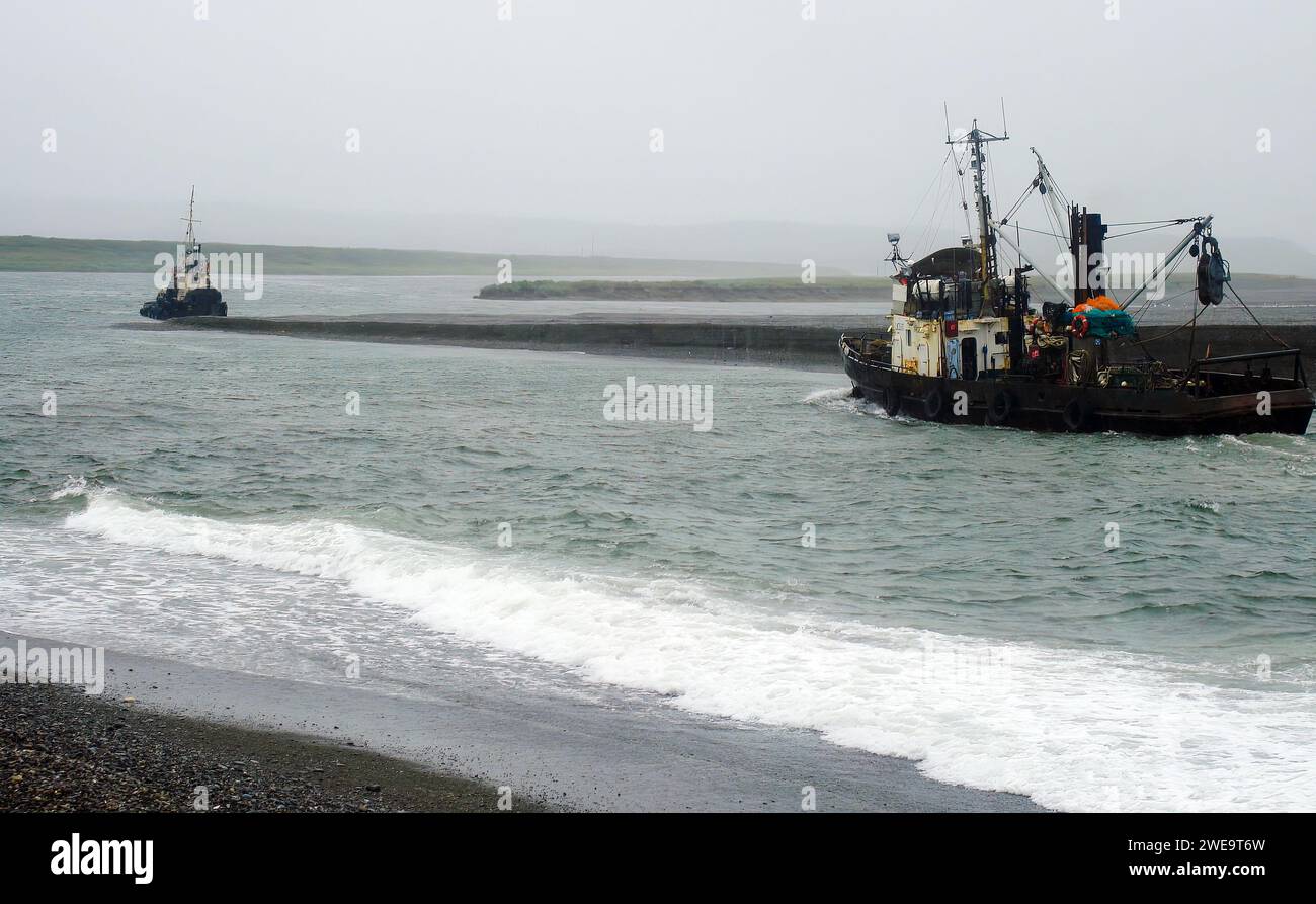 Two fishing vessels in shallow water. Stormy weather. Saltwater fishing ...