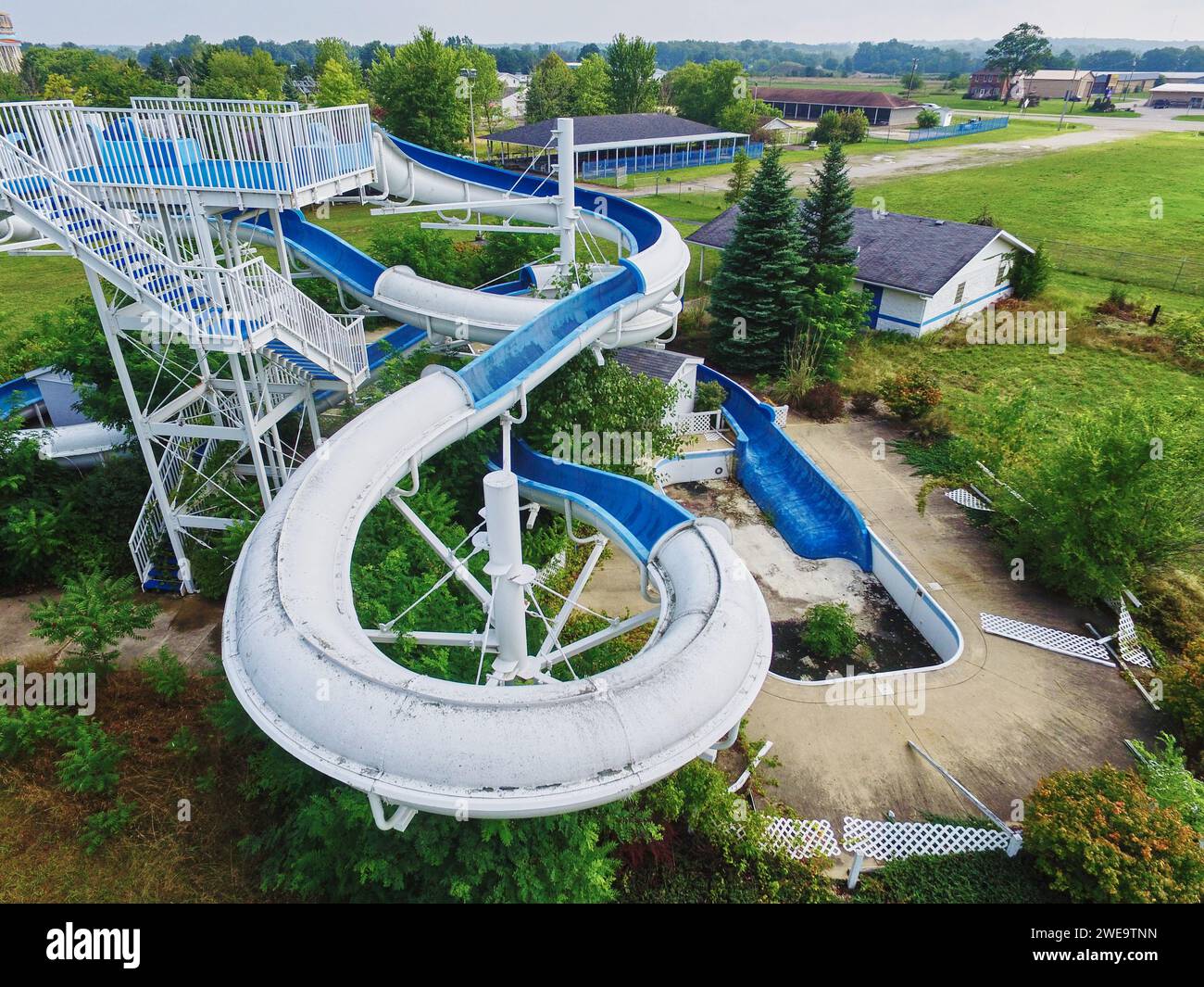 Aerial View of Deserted Water Park with Blue Loop Slide and Overcast ...