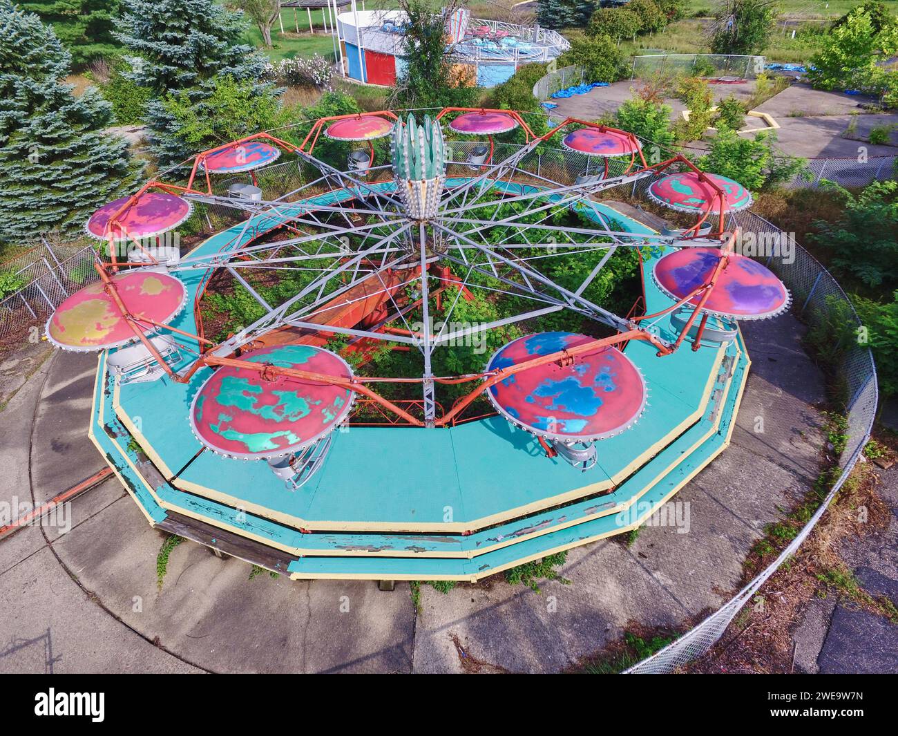 Aerial View of Abandoned Octopus Ride Amidst Overgrown Nature Stock ...