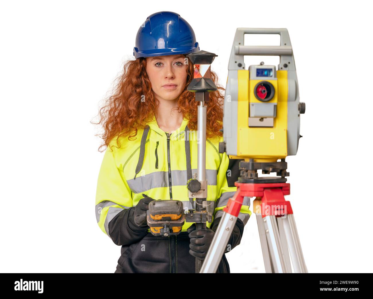 Red hair Woman in blue hardhat and yellow ppe surveyor working with ...
