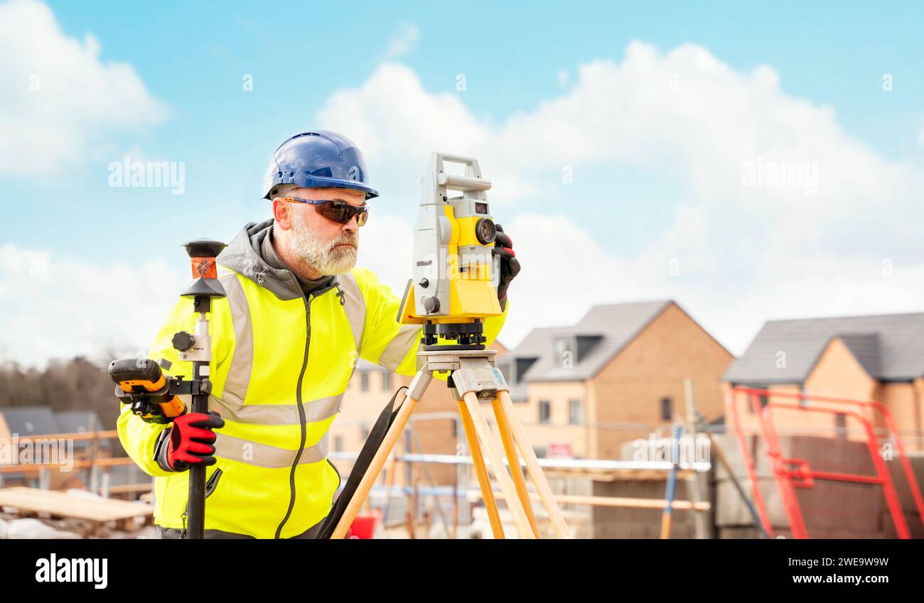 Surveyor builder site engineer with theodolite total station at ...