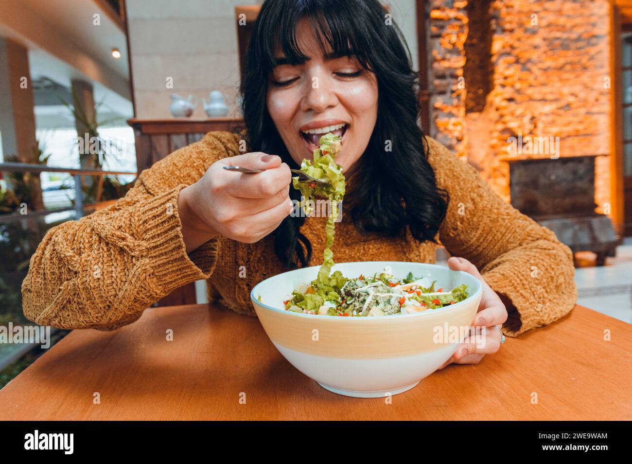 young latin venezuelan woman with open mouth and closed eyes, enjoying ...