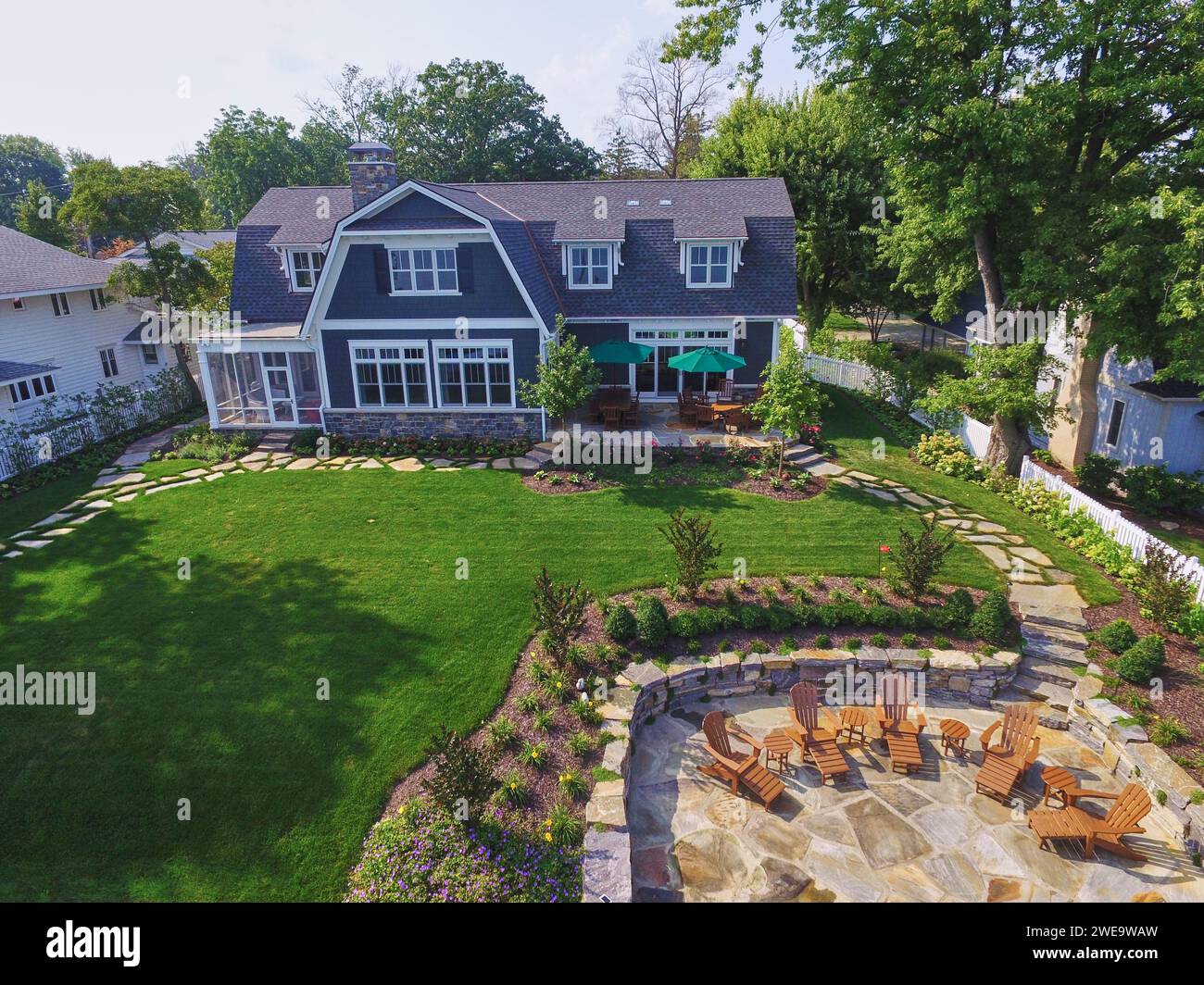 Aerial View of Luxury Suburban Home with Lush Backyard and Patio Stock ...