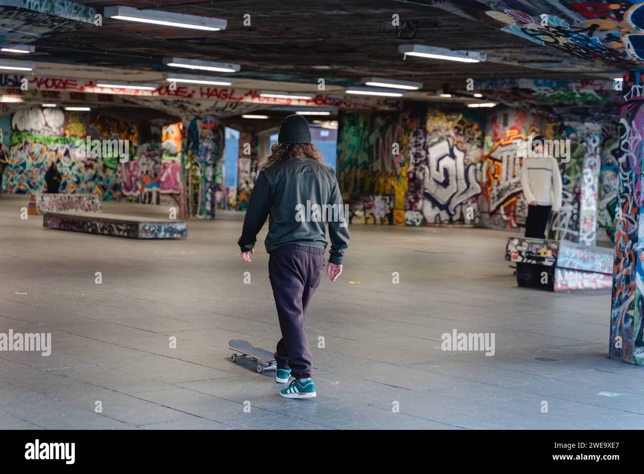 London, England - December 9, 2022: Teenagers skateboarding in a skate ...
