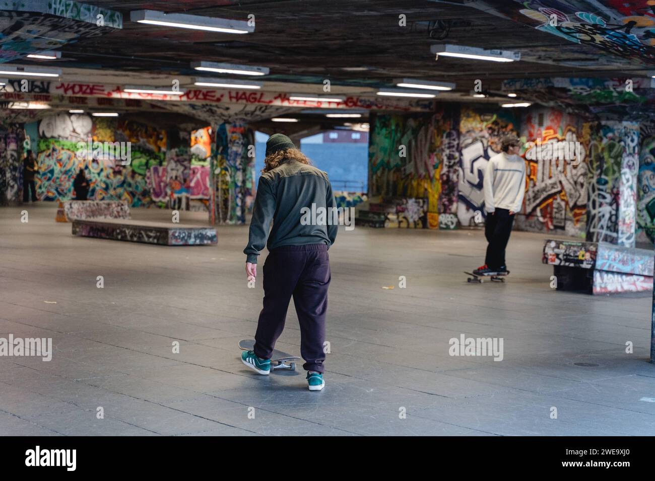 London, England - December 9, 2022: Teenagers skateboarding in a skate ...